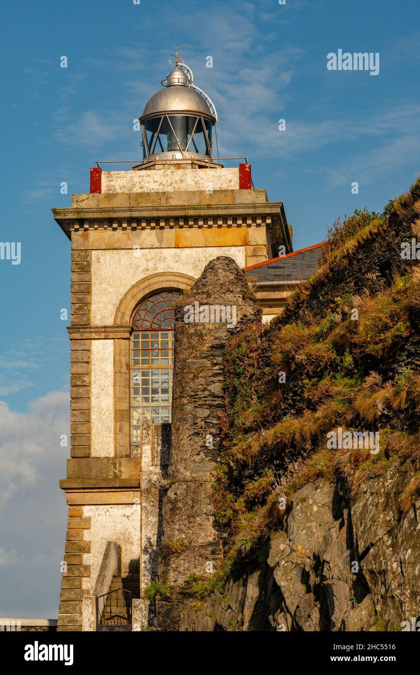 A lighthouse or light signaling tower located on the sea coast or on ...