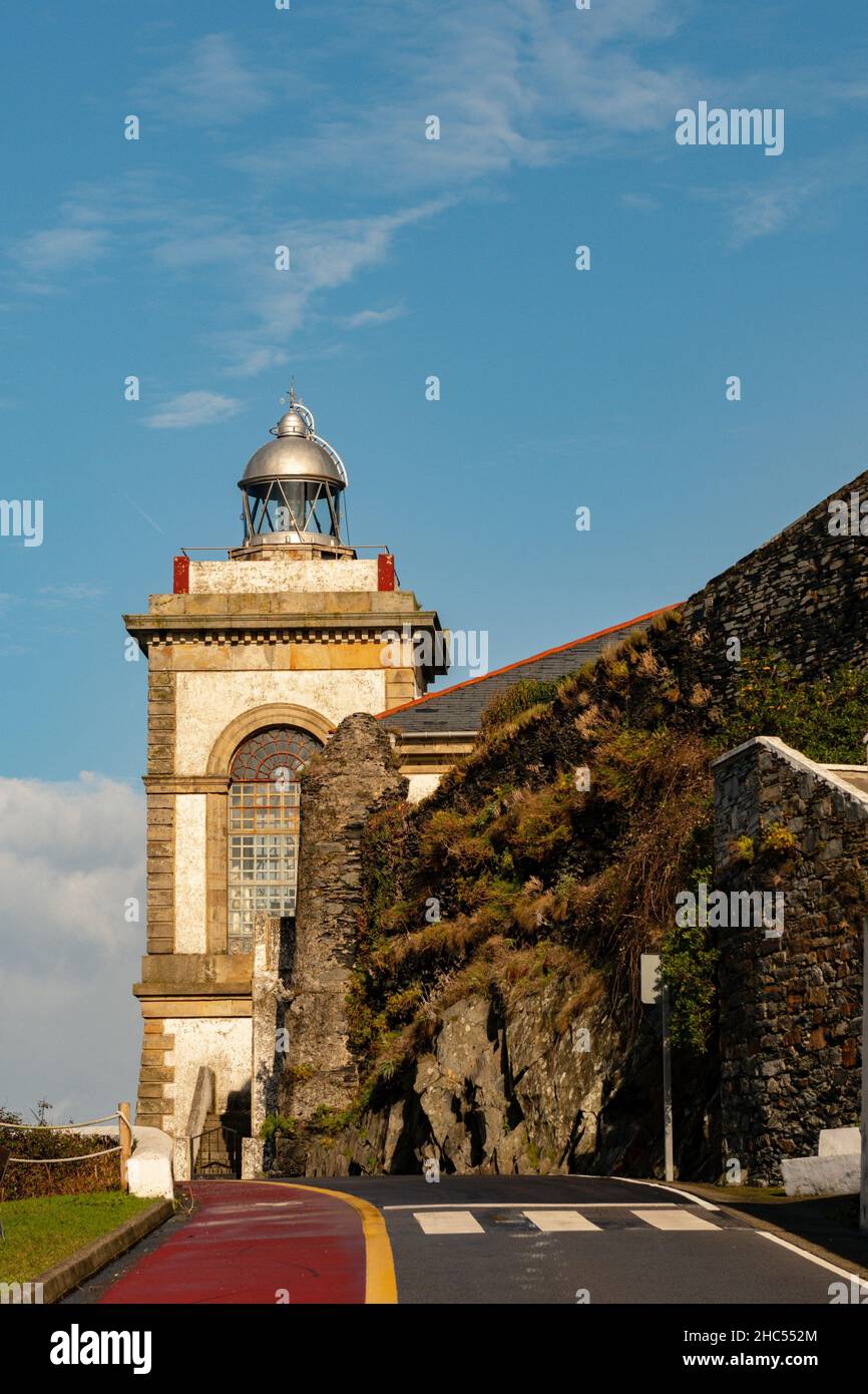 A lighthouse or light signaling tower located on the sea coast or on ...