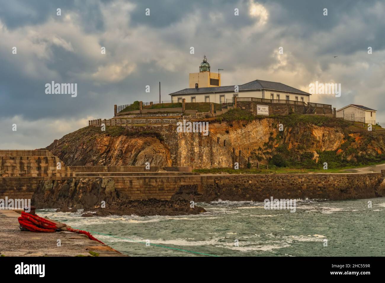 A lighthouse or light signaling tower located on the sea coast or on ...