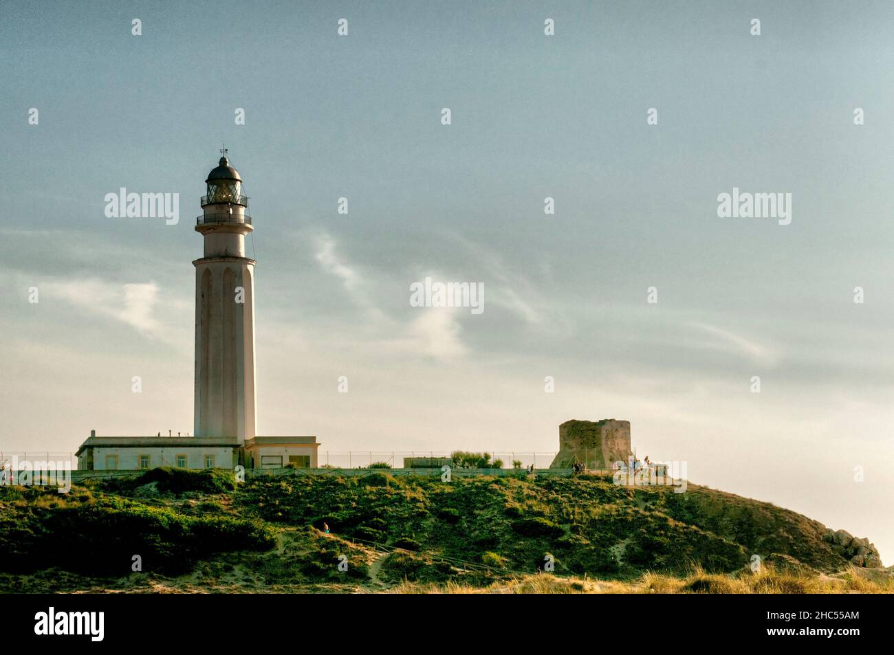 A lighthouse or light signaling tower located on the sea coast or on ...