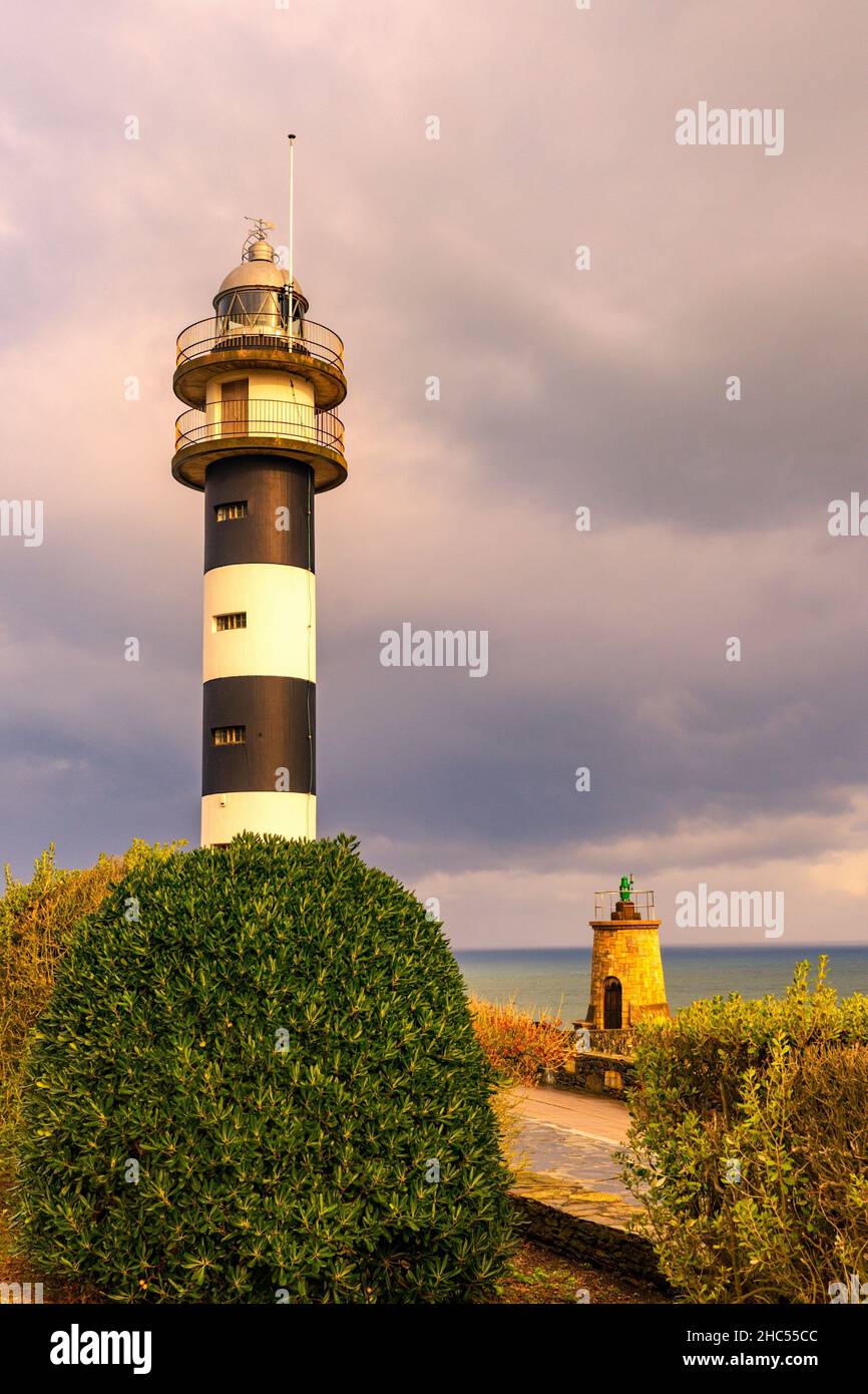 A lighthouse or light signaling tower located on the sea coast or on ...