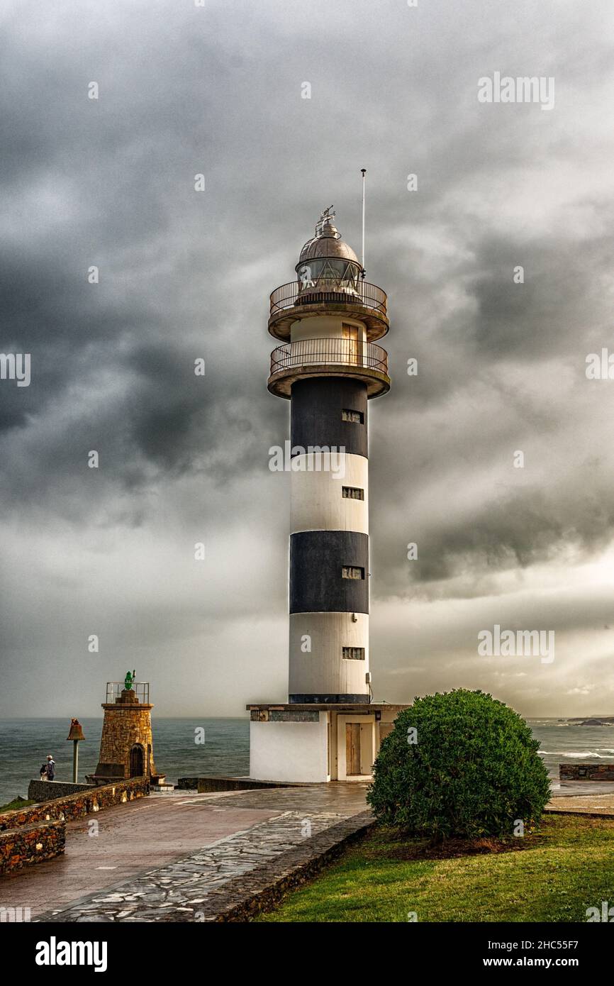 A lighthouse or light signaling tower located on the sea coast or on ...