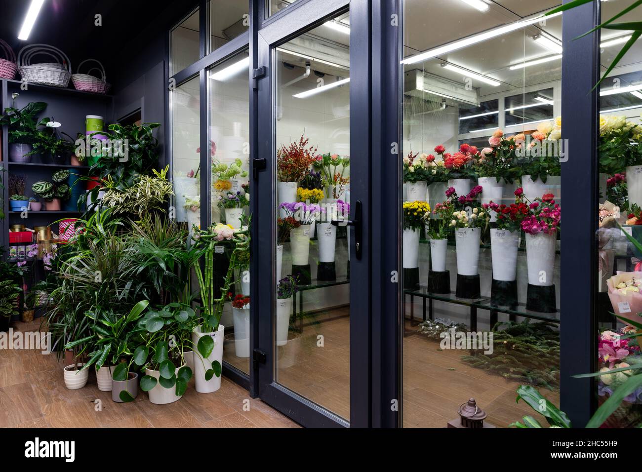 showcase of a florist shop selling natural flowers with bouquets in a ...