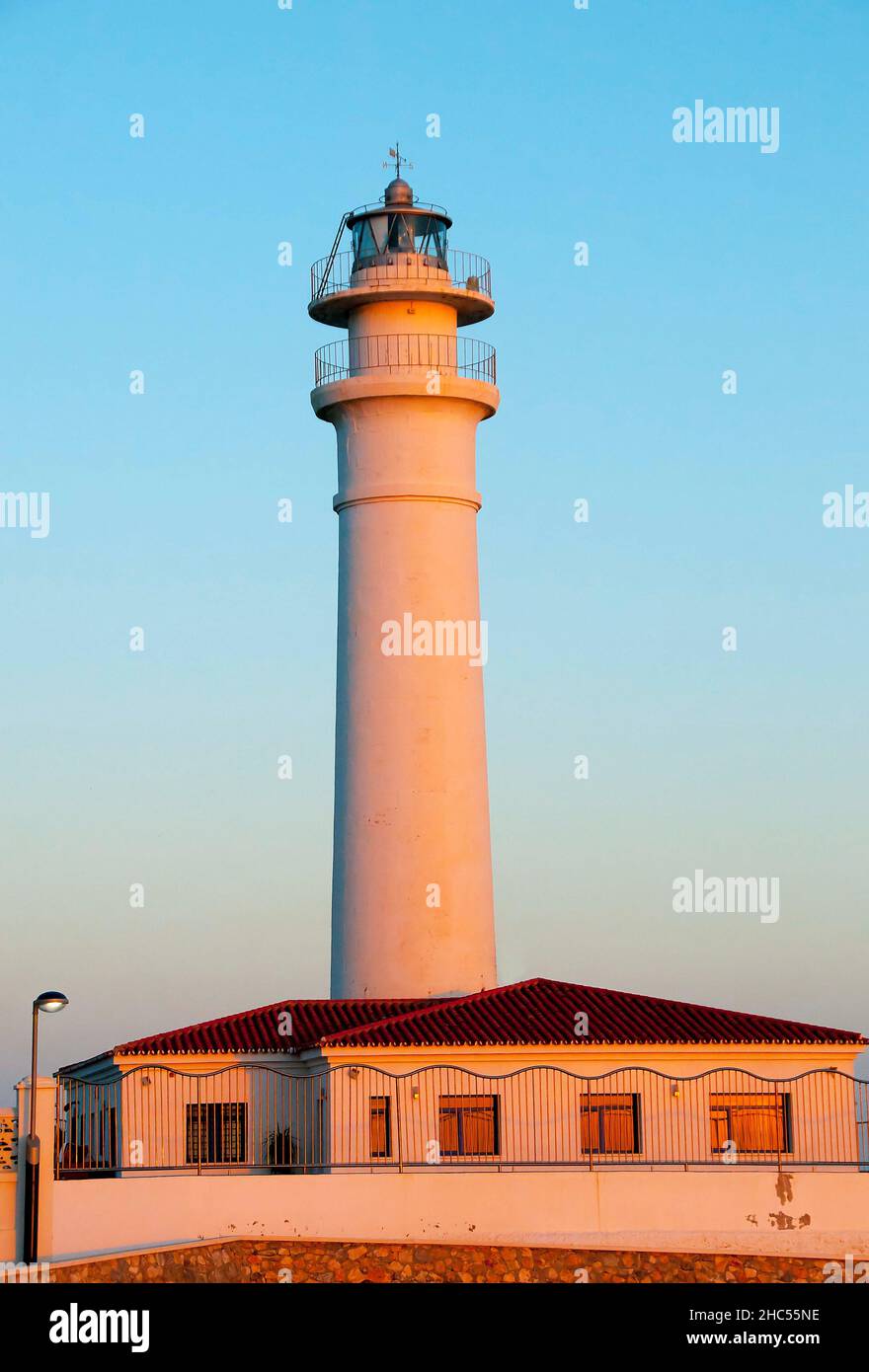 A lighthouse or light signaling tower located on the sea coast or on ...