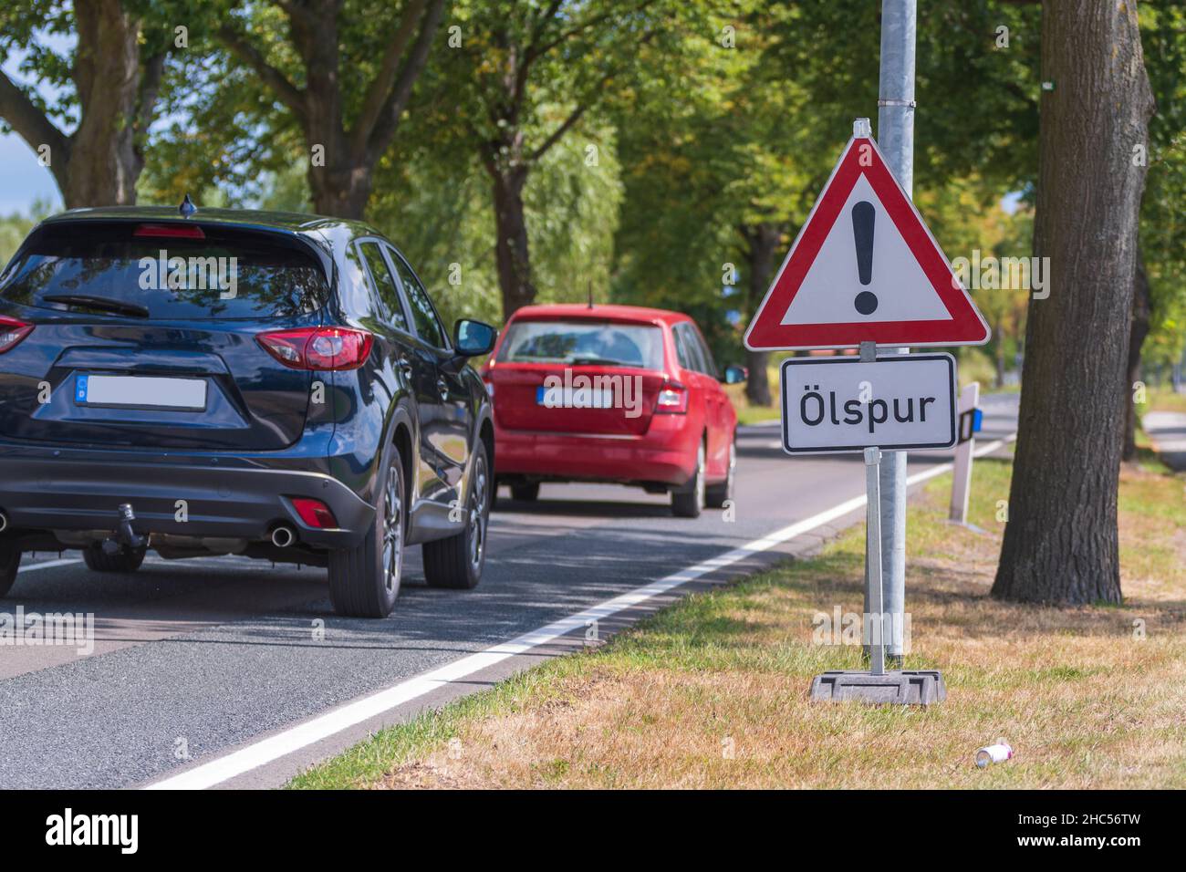 Warning sign with the inscription Oil track Stock Photo - Alamy