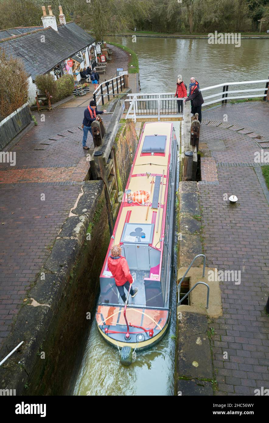 Narrow boat about to exit the lowest lock of the staircase of locks on ...