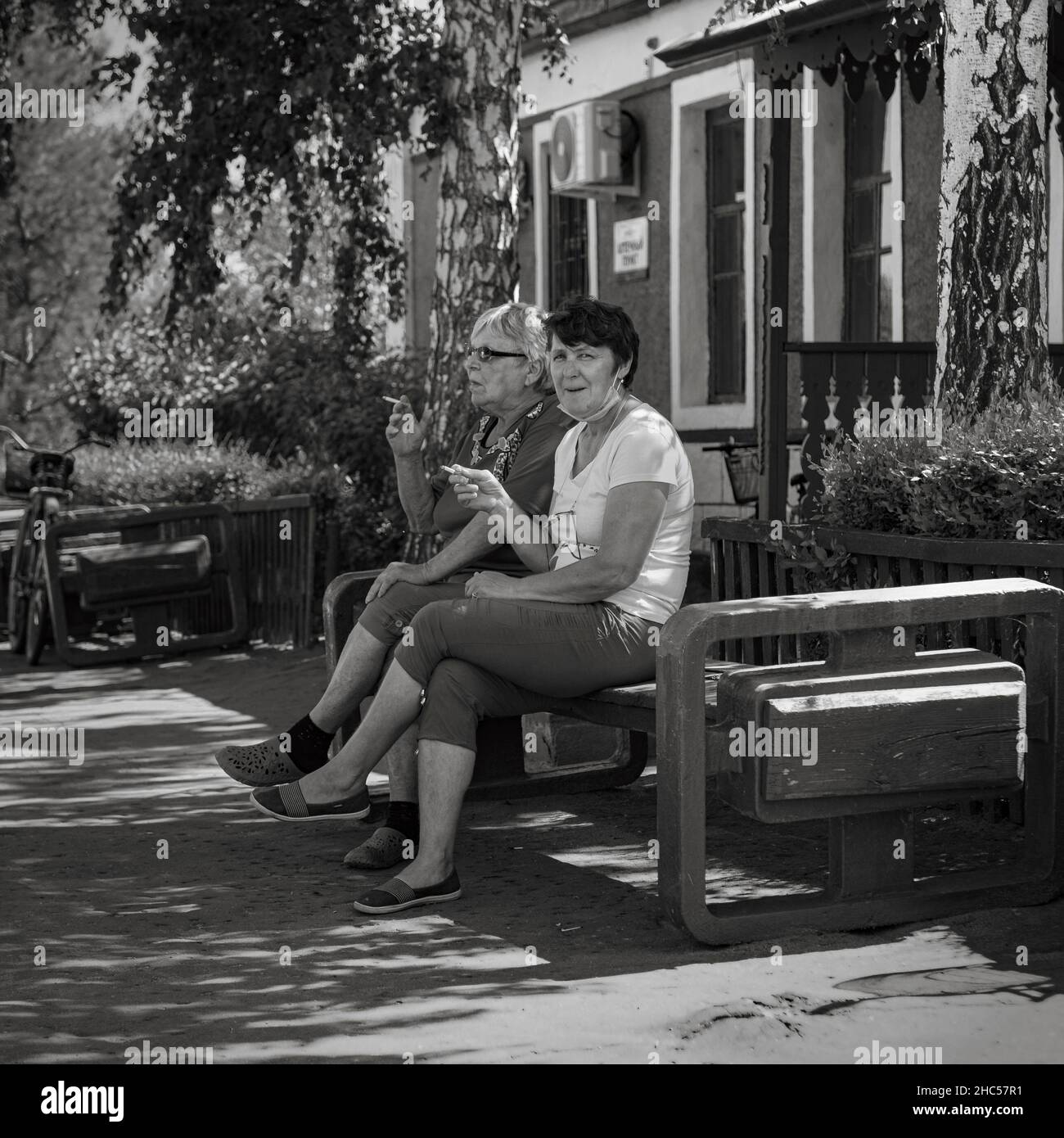 18th of July 2020, Russia, Altay, two women smoke and communicate on ...