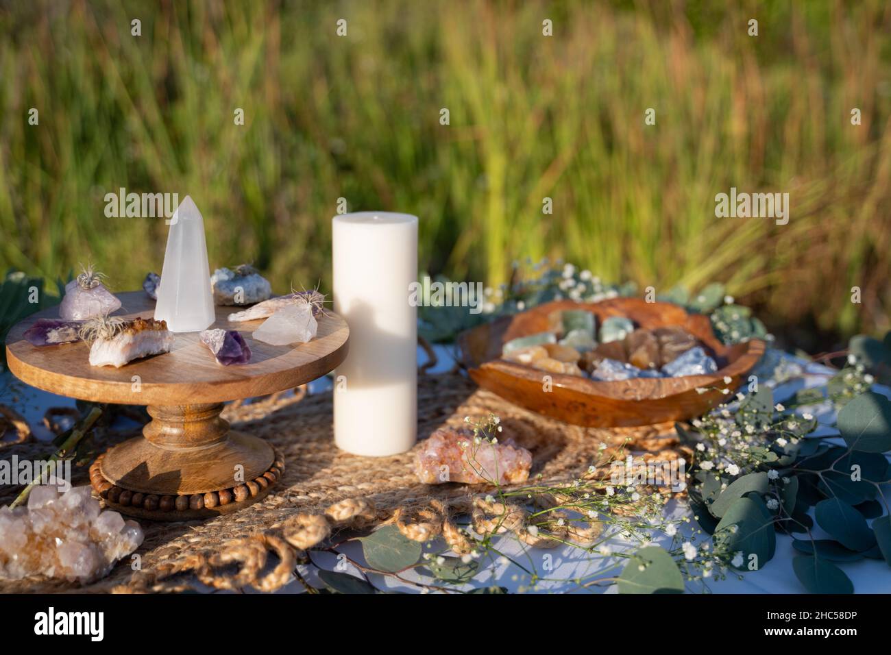 Beautifully decorated ceremonial table with mineral stones, plants, and ...