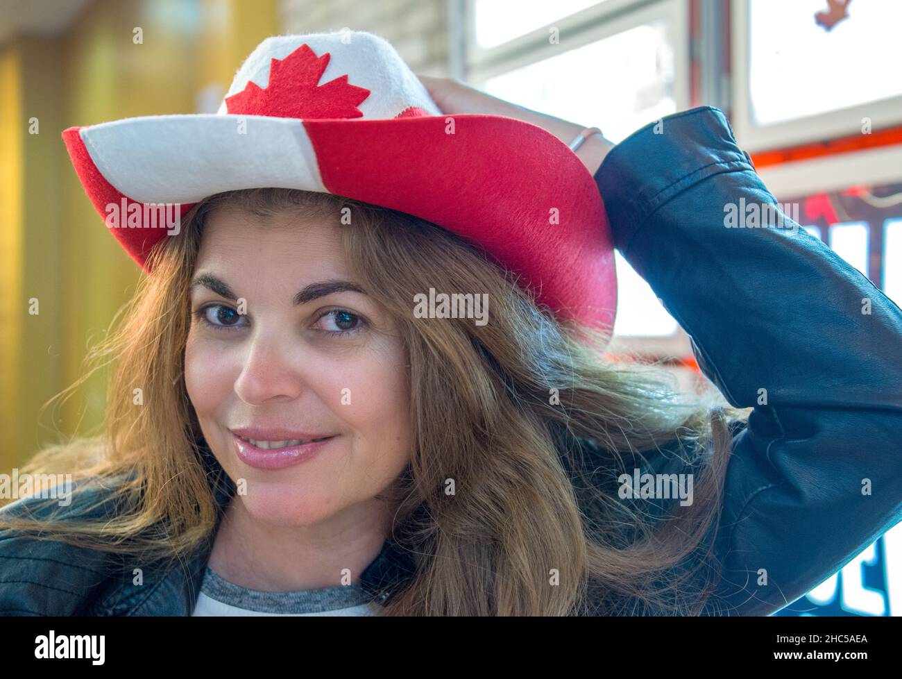 Woman with long hair and a hat hi-res stock photography and images - Alamy