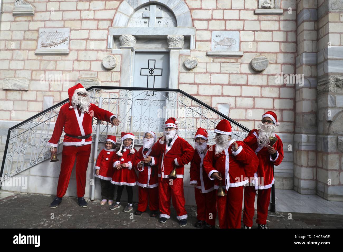 Gaza, Palestine. 24th Dec, 2021. A Palestinian man with children ...