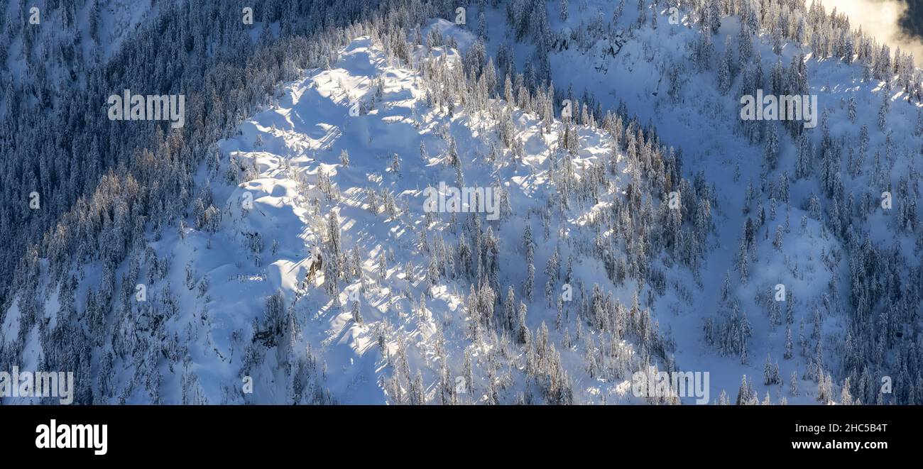 Aerial Panoramic View of Canadian Mountain covered in snow Stock Photo ...