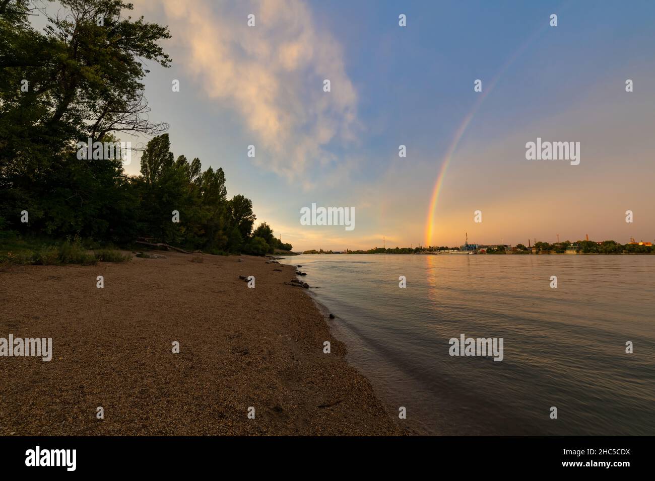 Rainbow over the Danube river in sunset Stock Photo - Alamy