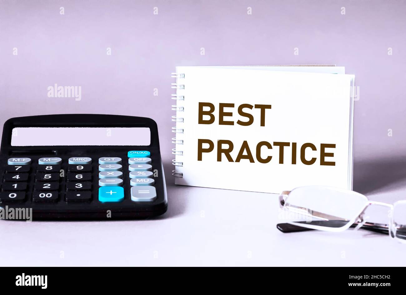 Best practice text concept on notepad and light background with marks ...