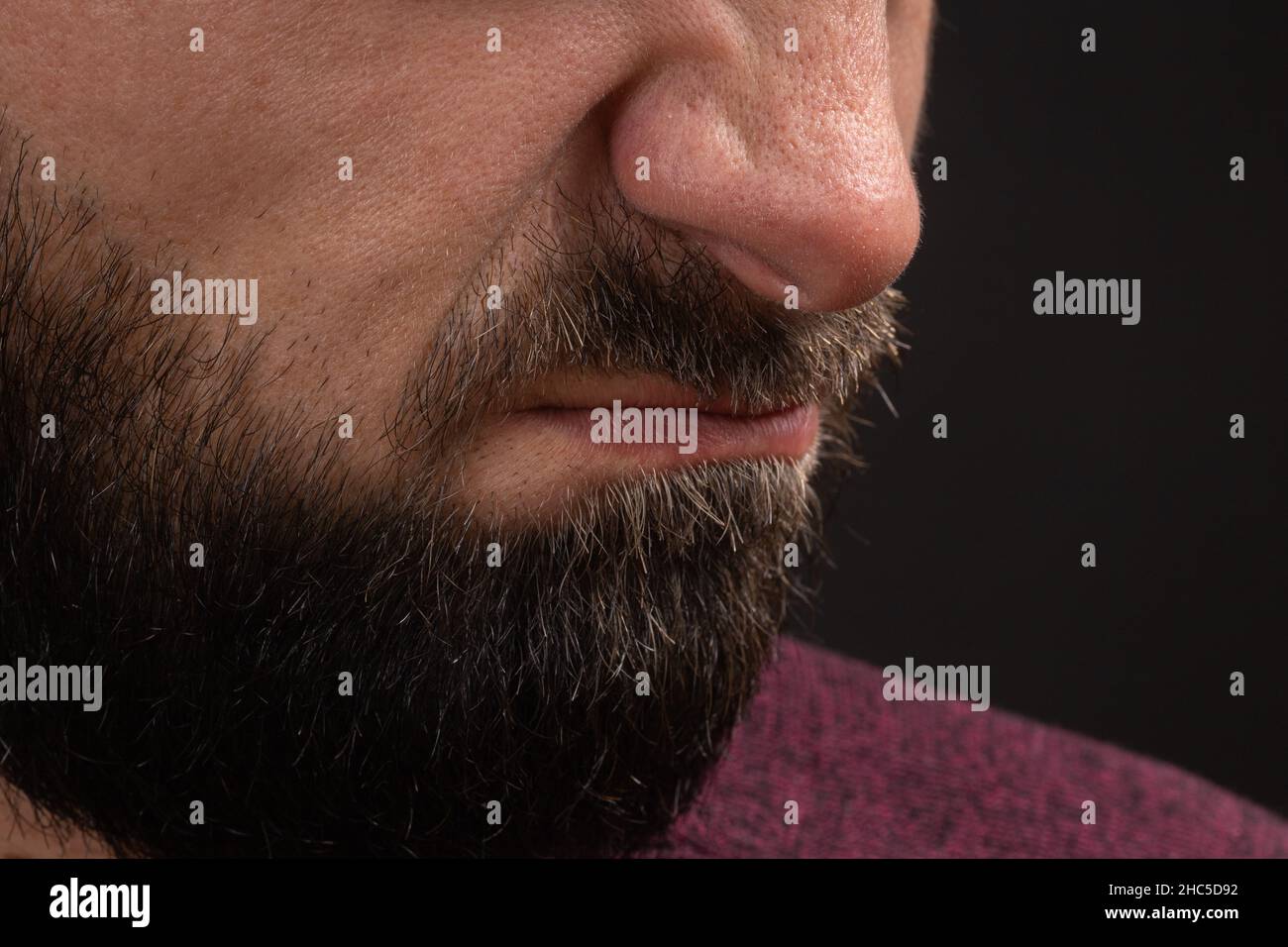 wrinkled grimace of danger, closeup on face and lips of young ...