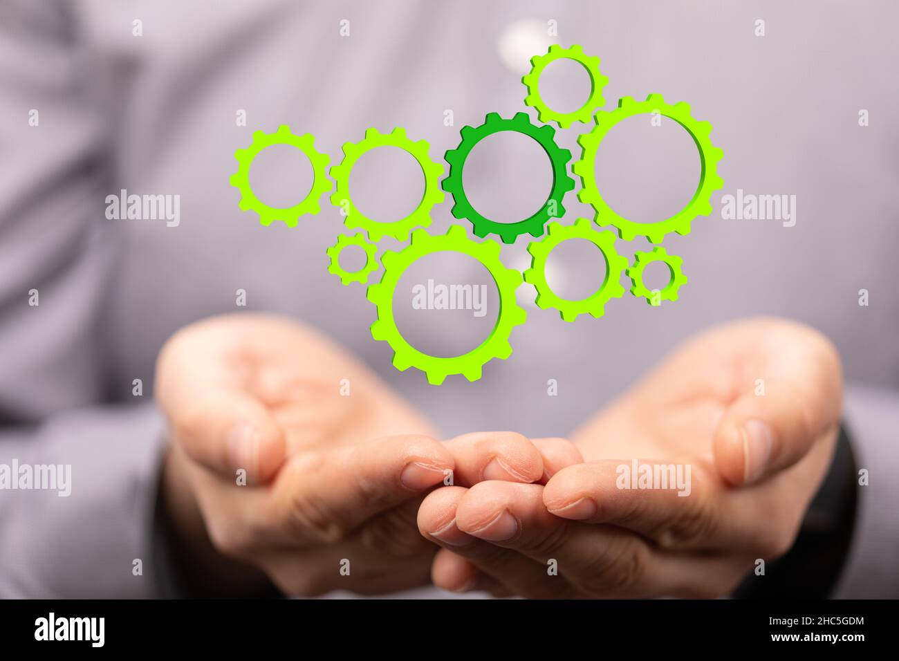 3D rendering of abstract digital gears in a humans hand Stock Photo - Alamy