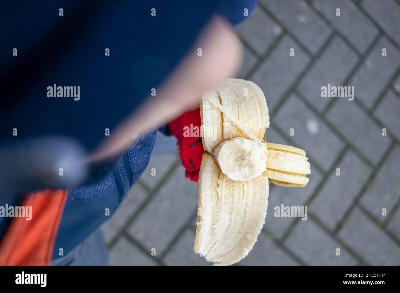 Top view shallow focus of a man eating a banana Stock Photo - Alamy