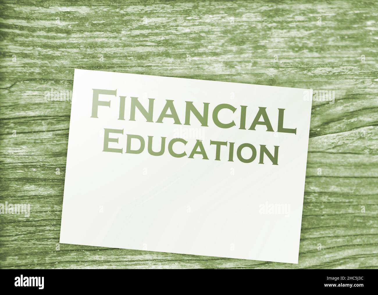 finacial education words on page and paper signs of dollar around ...