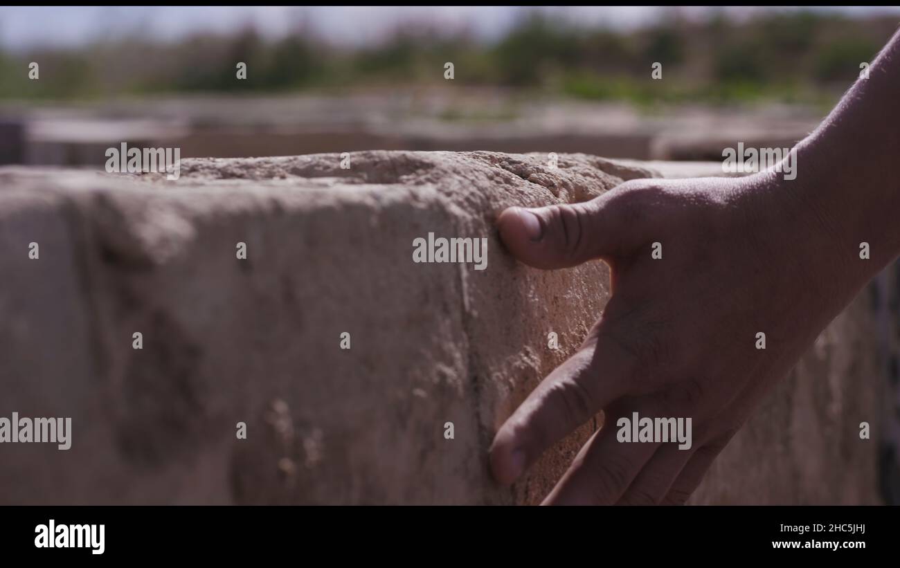 Mans hand touching wall outdoor hi-res stock photography and images - Alamy
