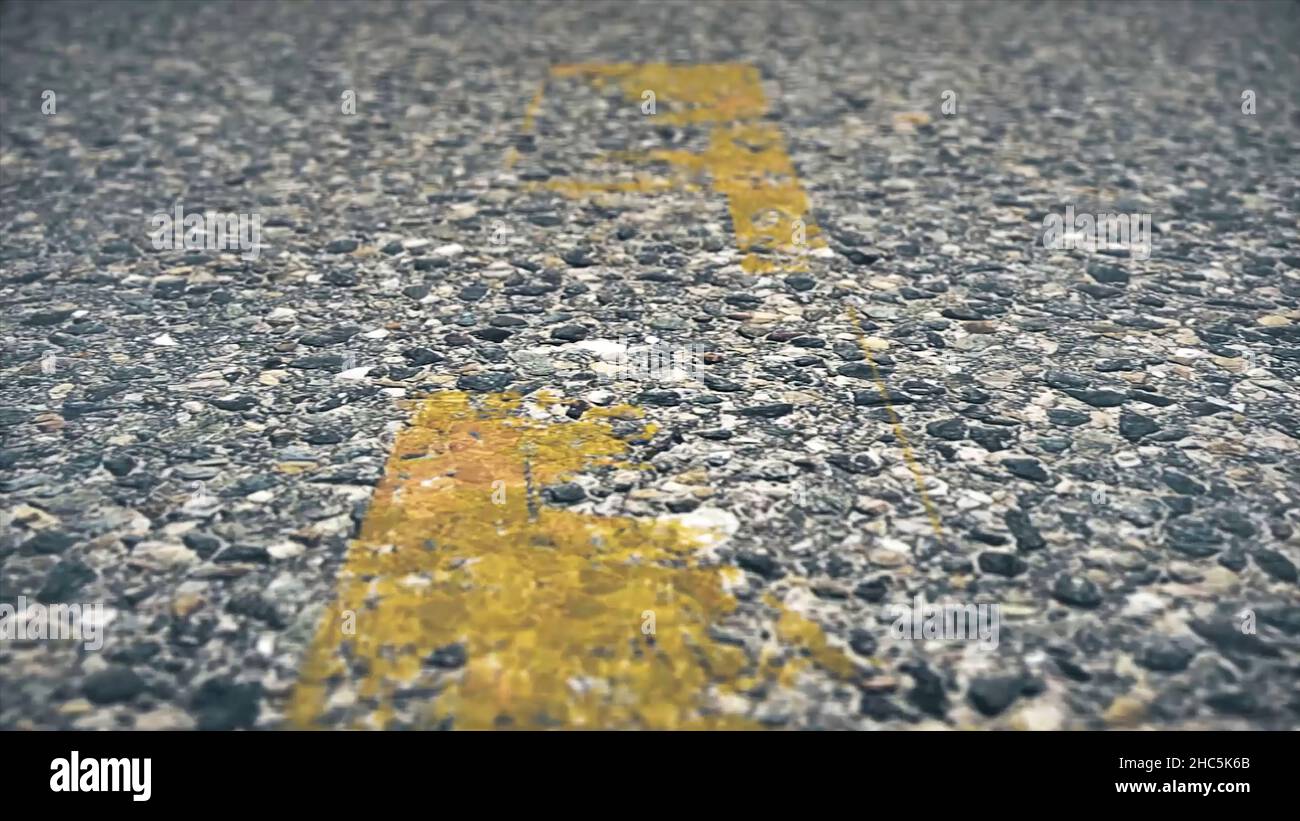 Structure of the asphalt, road marking. Close-up of animated road for ...