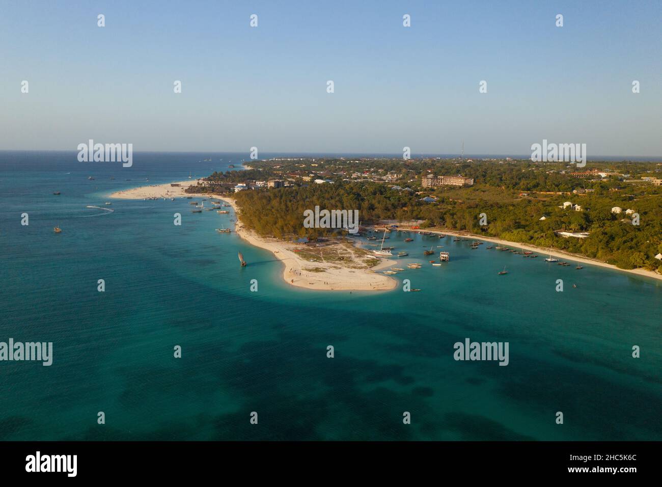 Aerial shot of coastline, boats, and seabed of Zanzibar Island ...