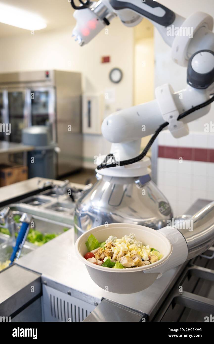 “Alfred,” an automated food preparation robot, prepares a salad at the ...
