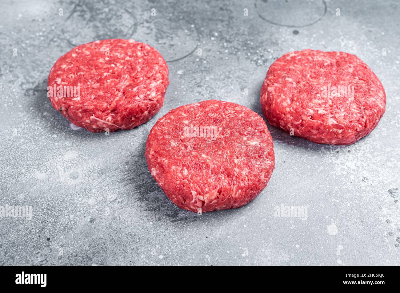 Raw Ground mince beef meat Burger steak cutlets. Gray background. Top ...