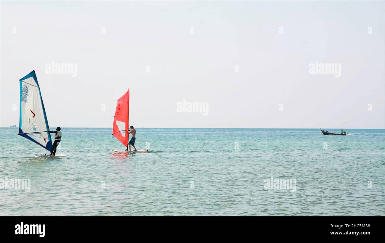 Windsurfer rides among the huge tubes and waves of the Indian Ocean on ...