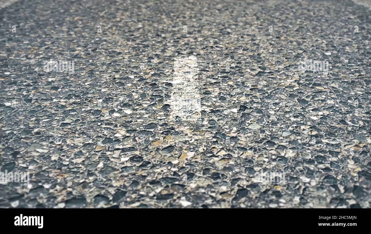 Structure of the asphalt, road marking. Close-up of animated road for ...