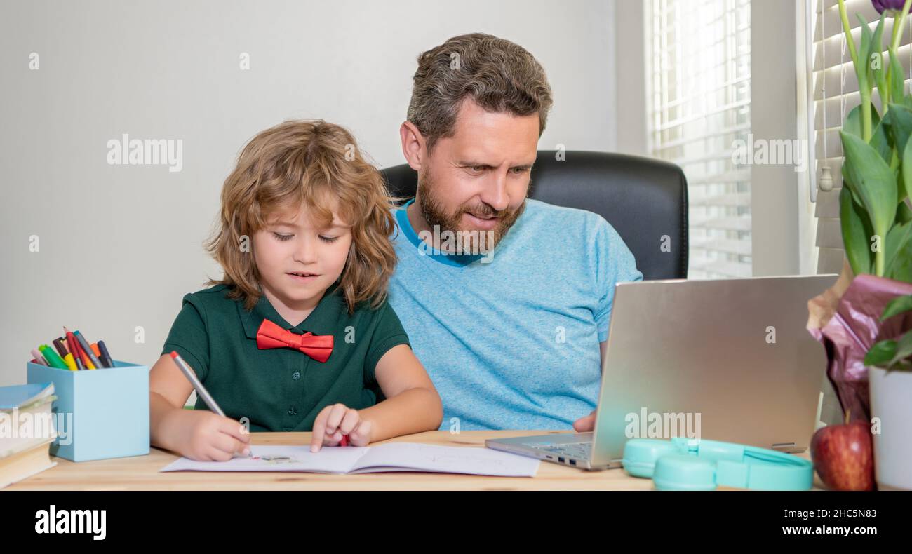 homeschooling and elearning. back to school. father and son use ...