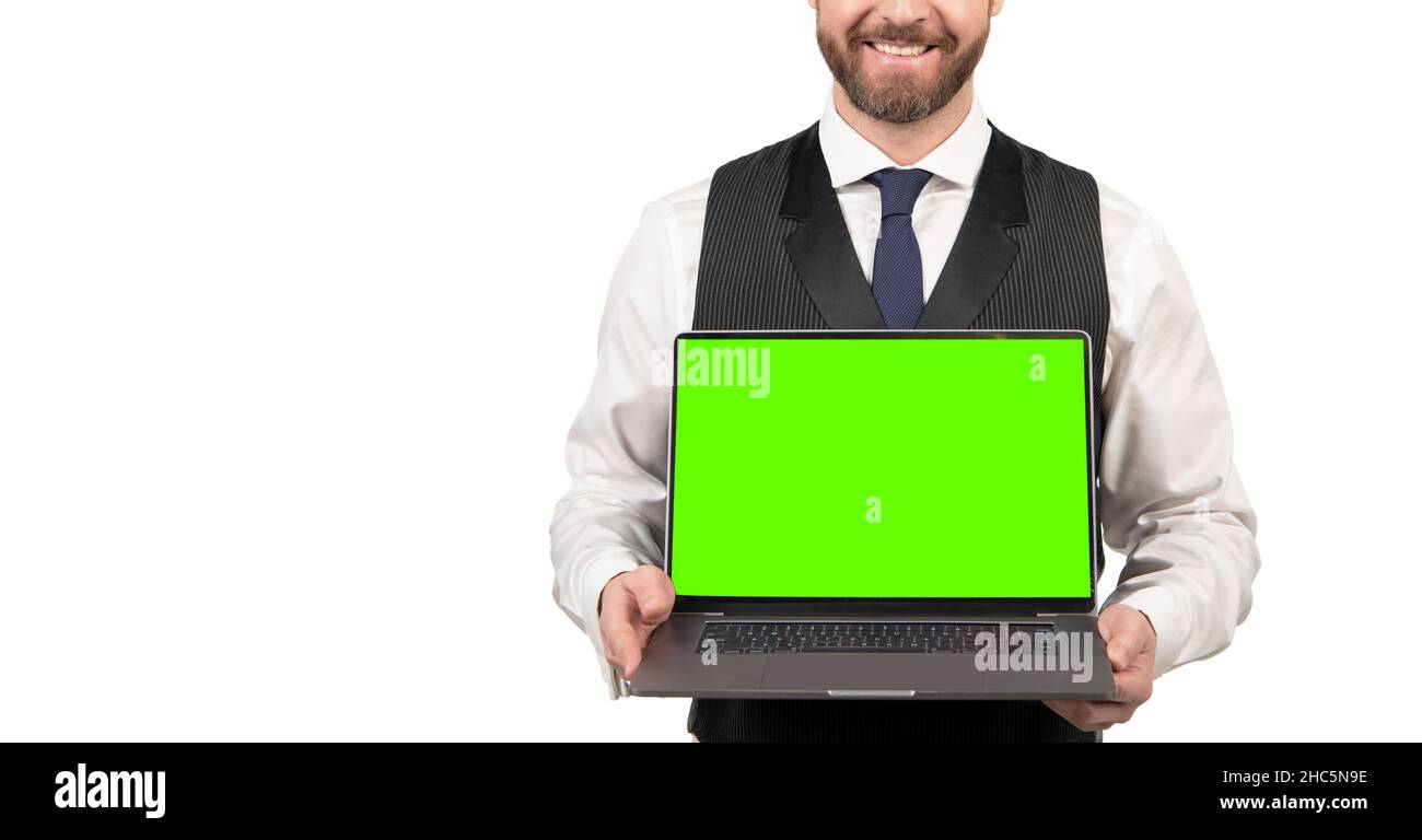 cropped man presenting of computer with green screen for copy space ...
