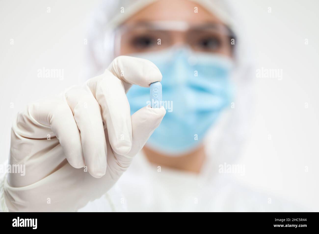 Female UK pharmacist wearing PPE personal protective equipment ...