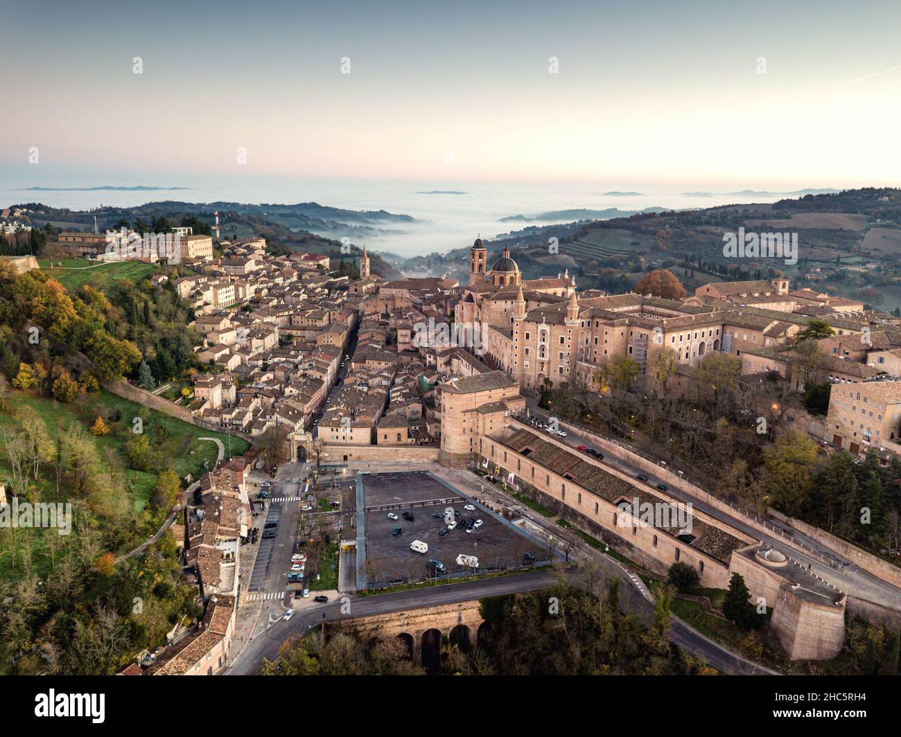 Aerial view of the medieval walled city on a mountain during the day ...