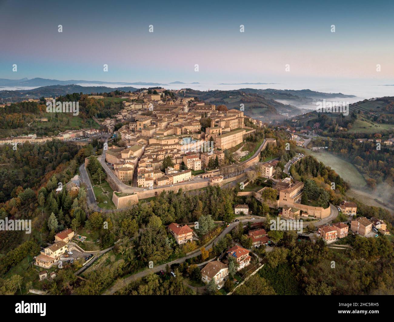 Aerial view of the medieval walled city on a mountain during the day ...
