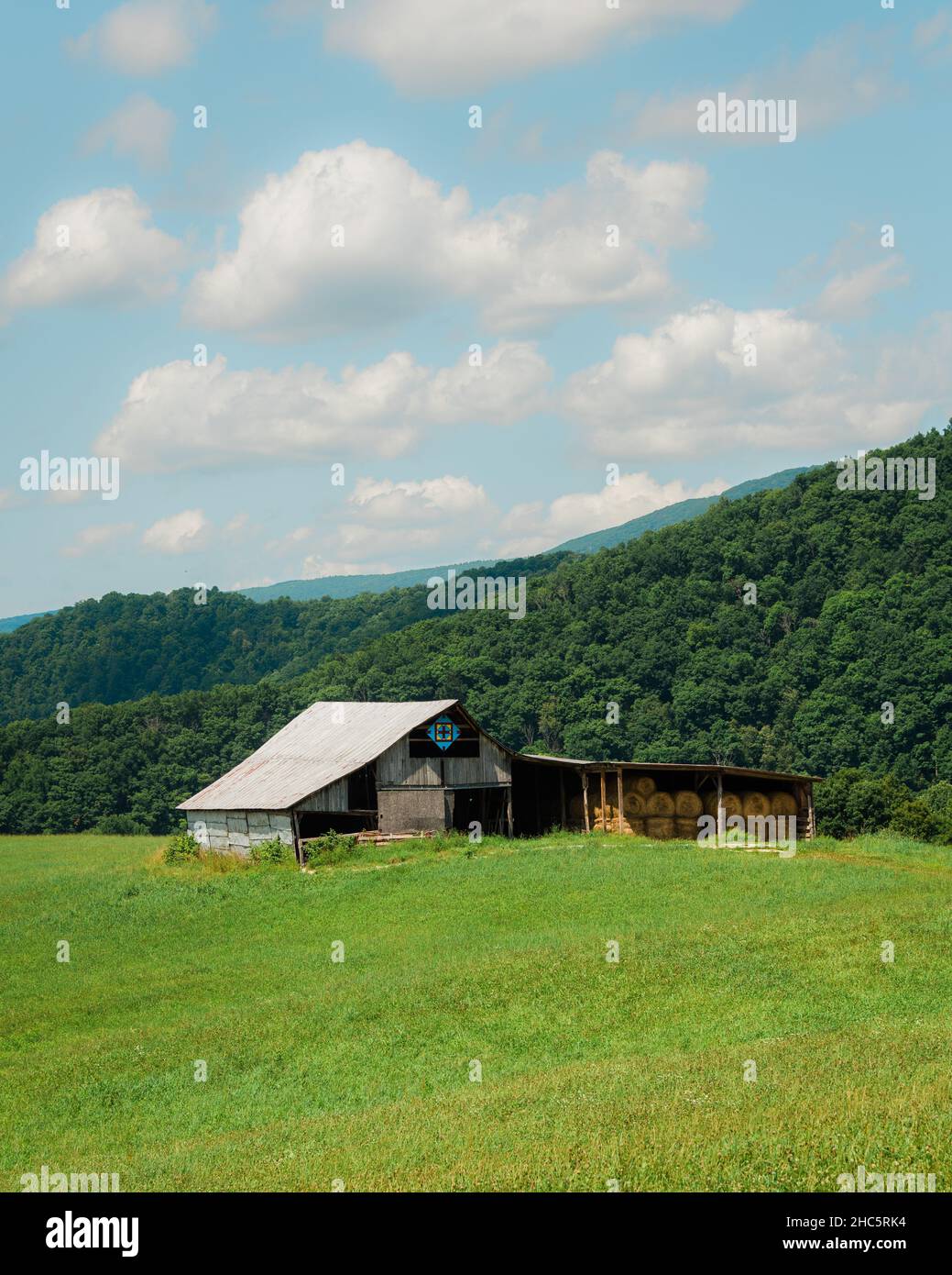 Rural scene with farm fields and barn in the mountains of West Virginia ...