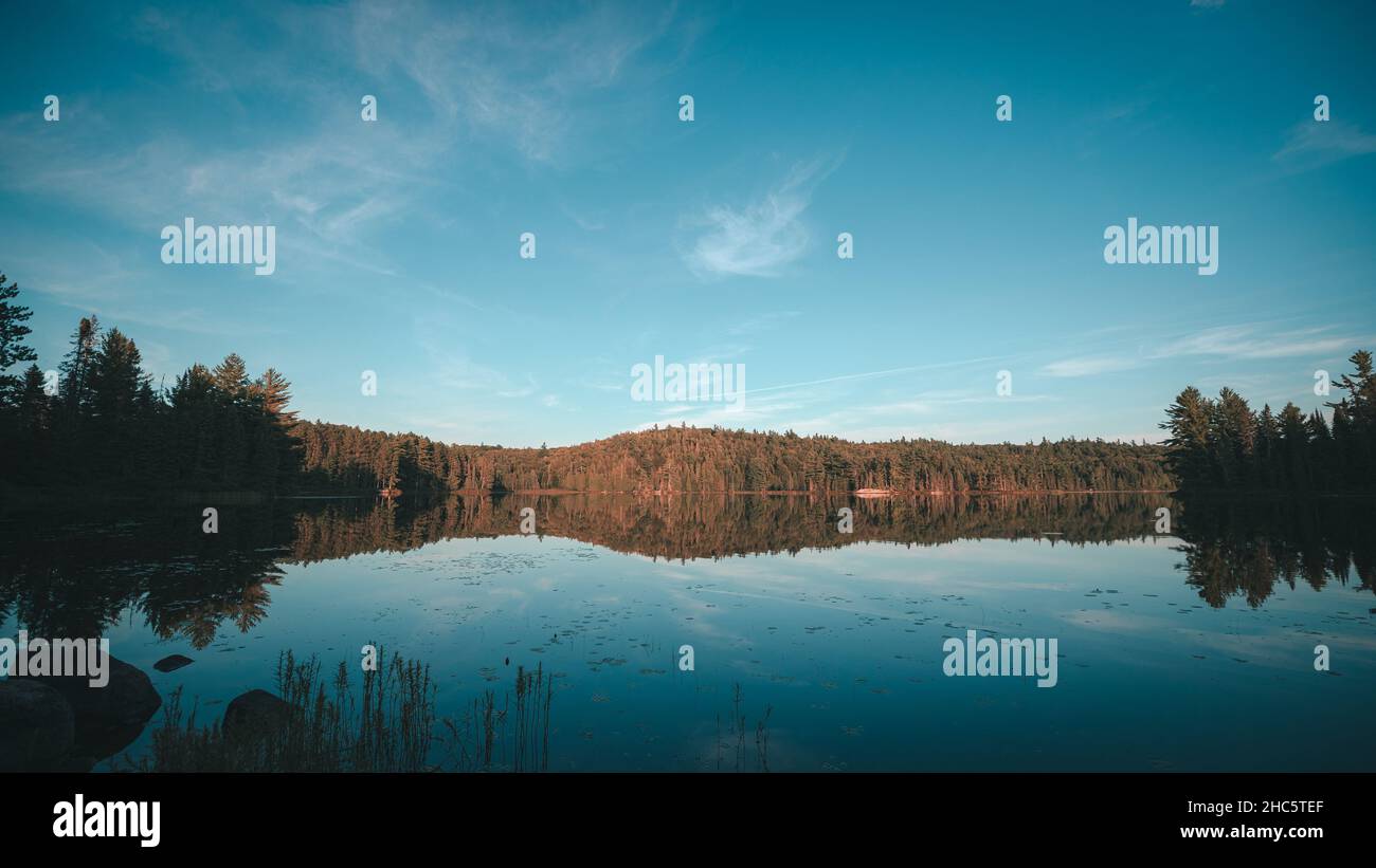 Landscape of the blue heaven reflected in the lake Stock Photo - Alamy