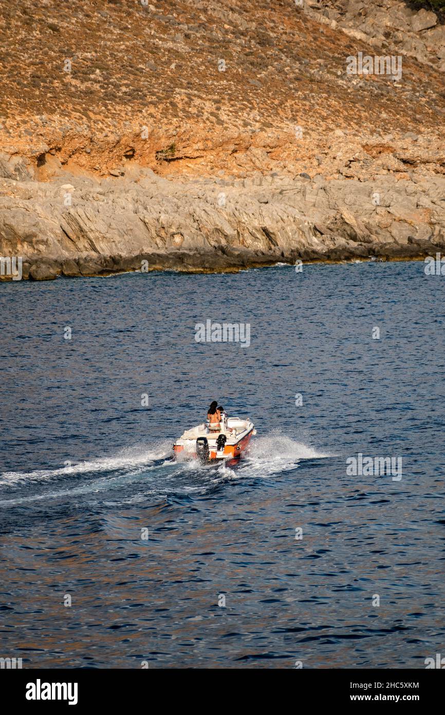 People riding in a speedboat in Crete, Greece Stock Photo - Alamy