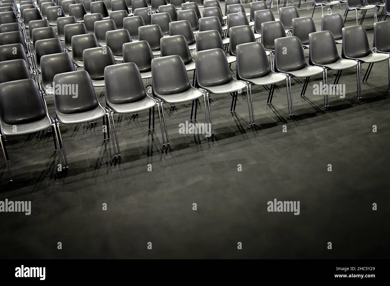 Gray empty audience seats arranged in rows Stock Photo - Alamy
