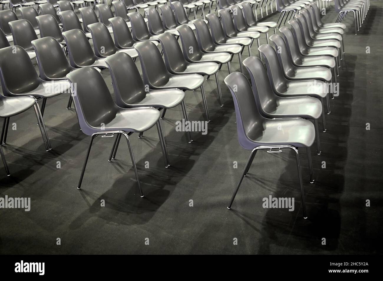 Gray empty audience seats arranged in rows Stock Photo - Alamy