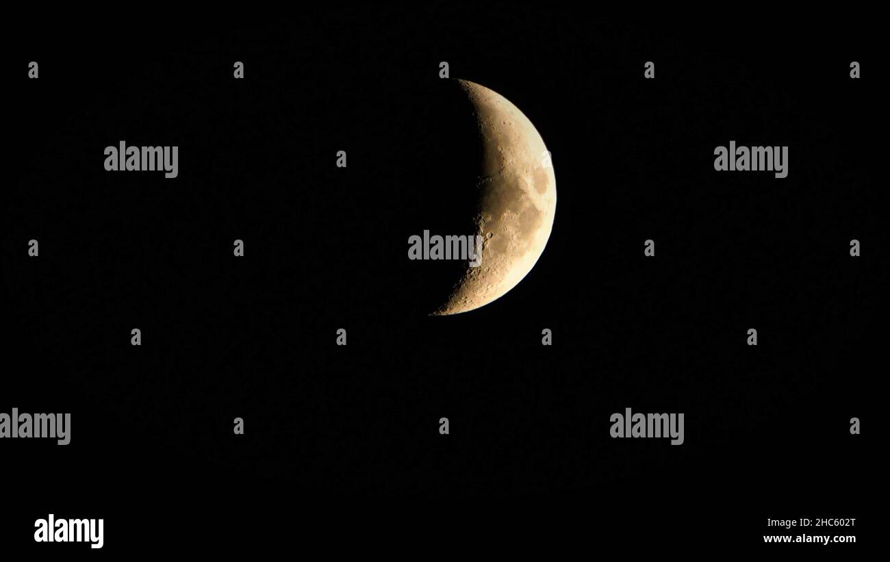 Half-moon with detailed surface visible on it isolated with night ...