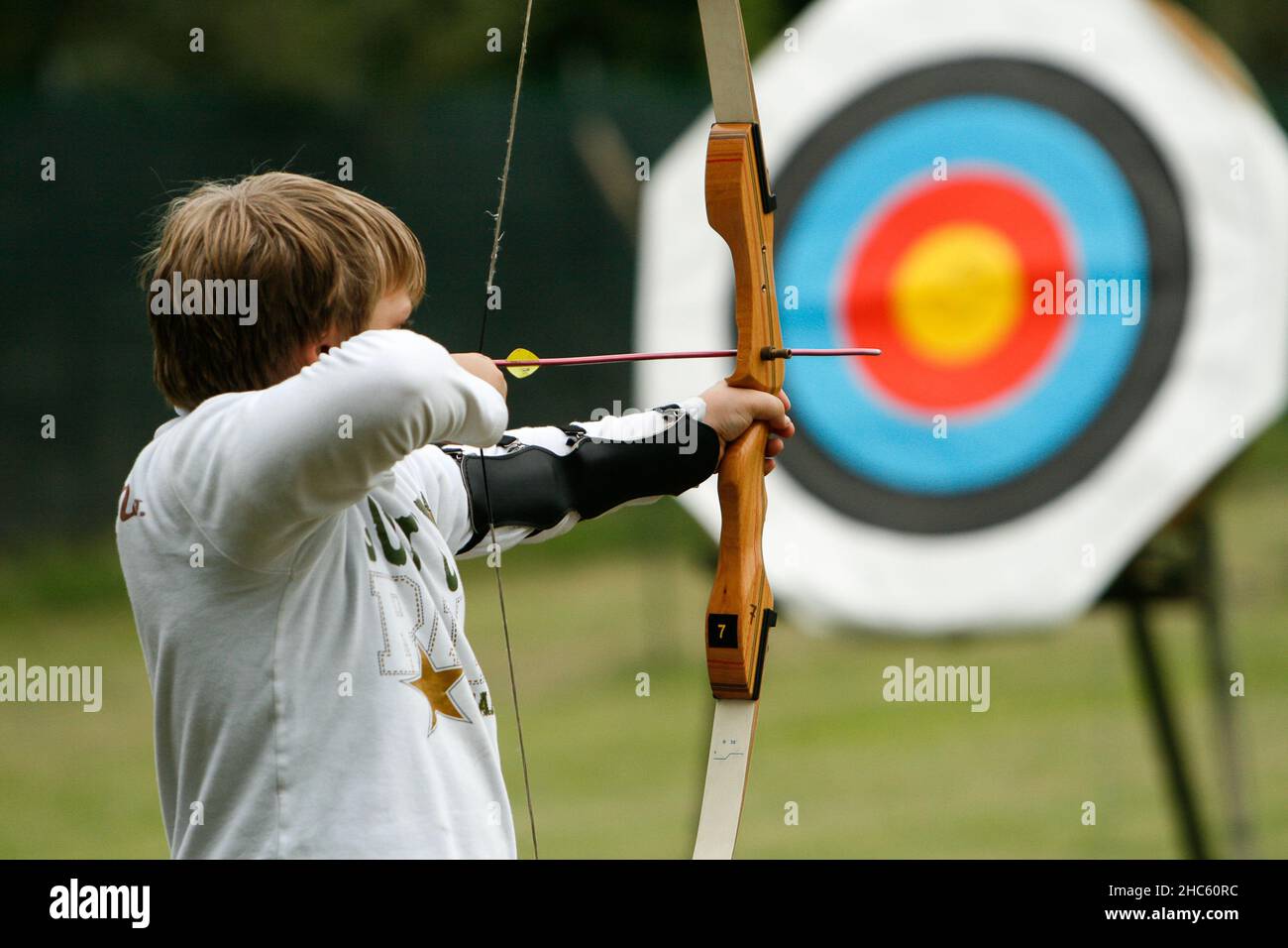 Child shooting arrow hi-res stock photography and images - Alamy