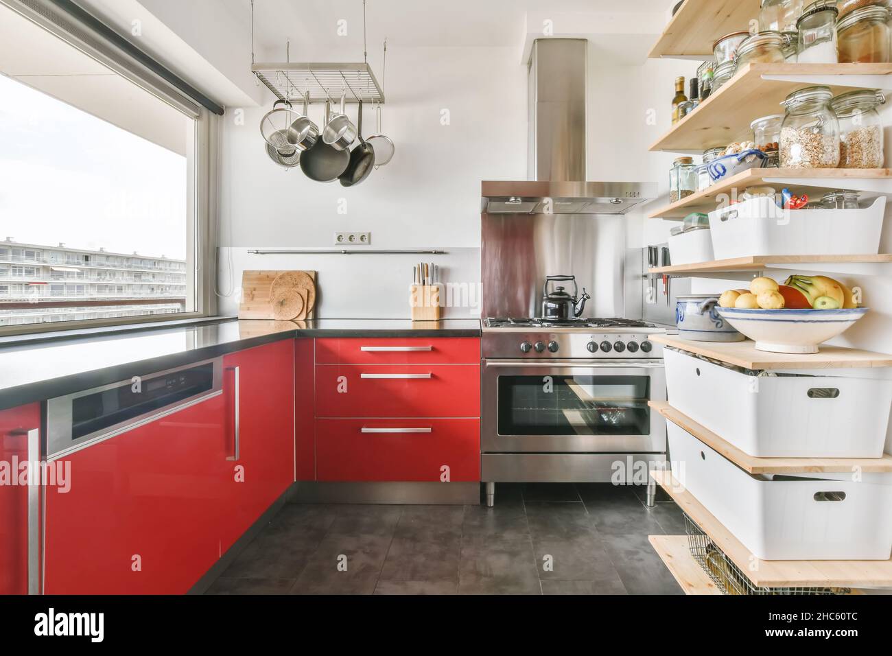 Stylish kitchen design with bright red kitchen set Stock Photo - Alamy