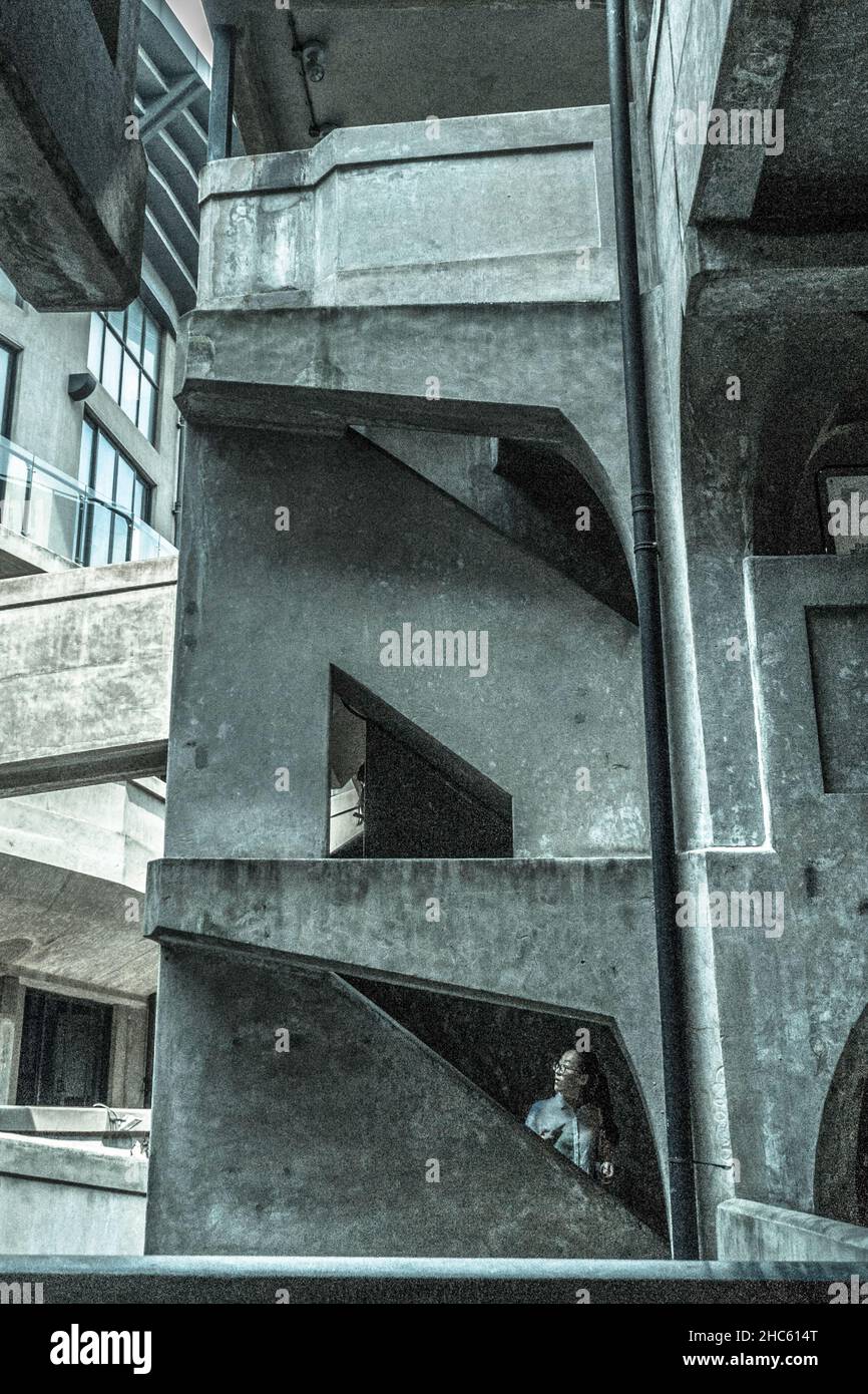 A woman is looking up while standing on the stair tower, 1933 ...