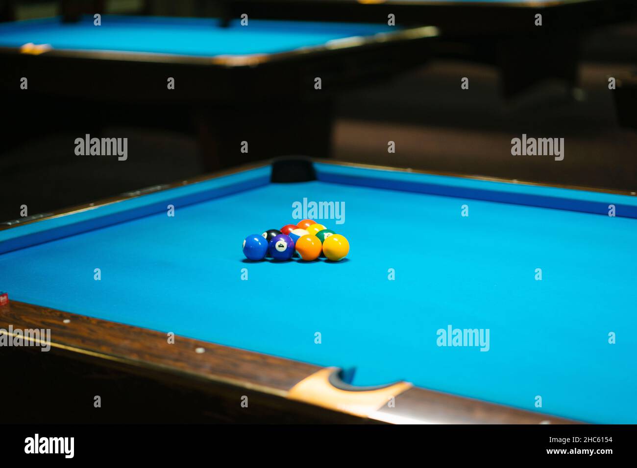Blue billiard table with balls Stock Photo - Alamy