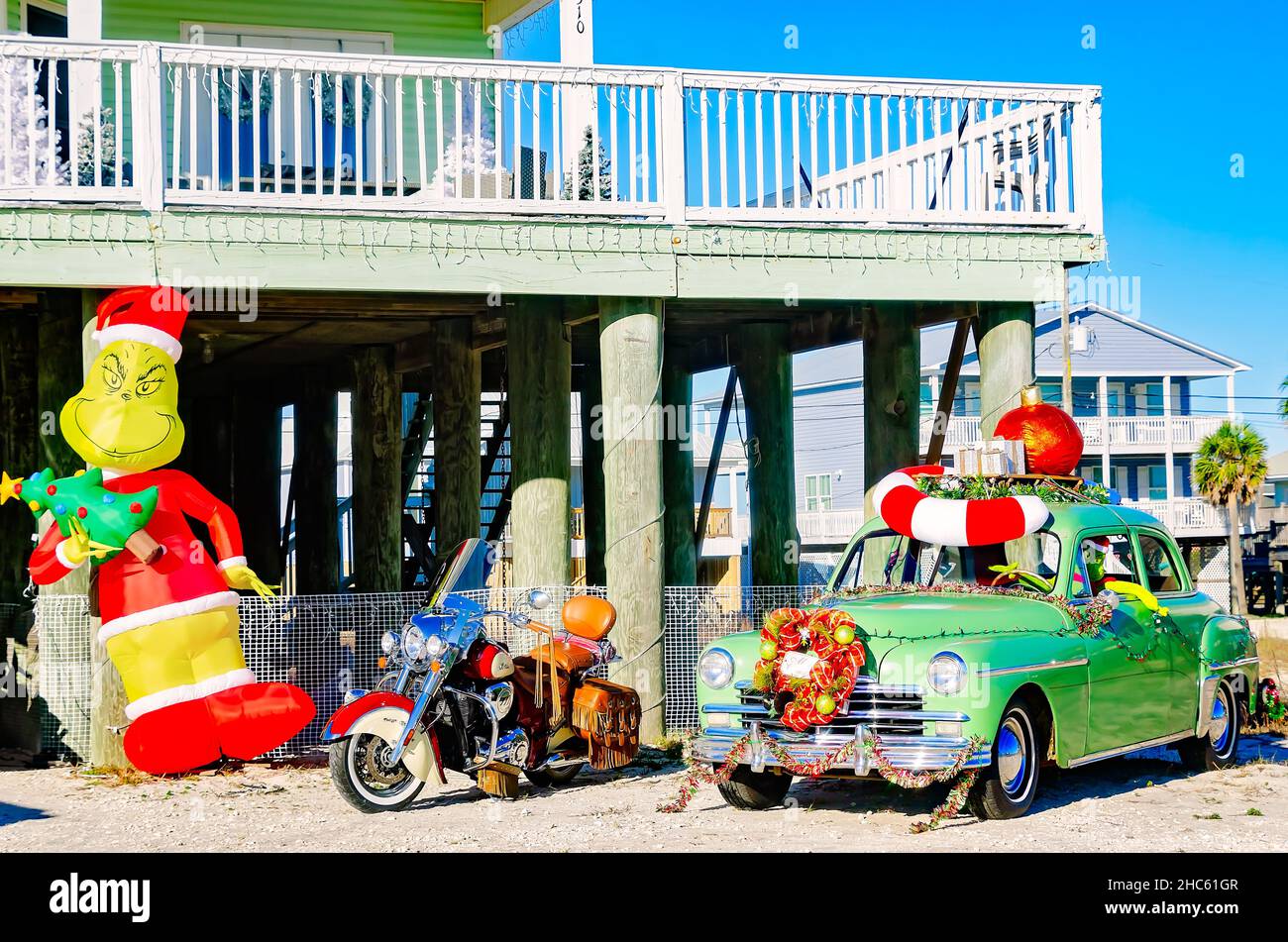 A beach house features Grinch-themed Christmas decorations, Dec. 24 ...