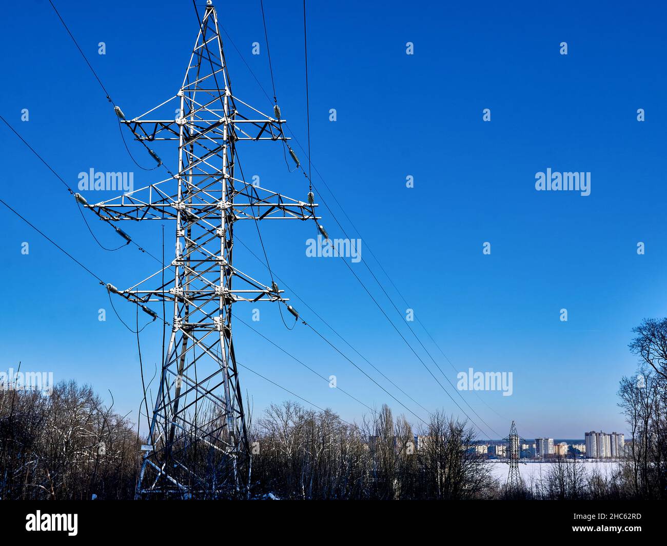 Power lines stretch from the right to the left bank of the city in ...