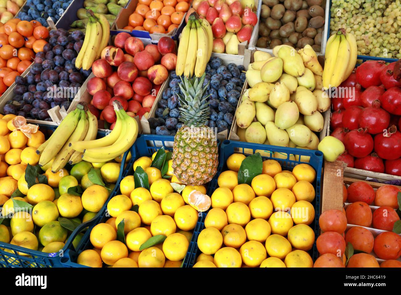 View of various fruits in boxes on market counter Stock Photo - Alamy
