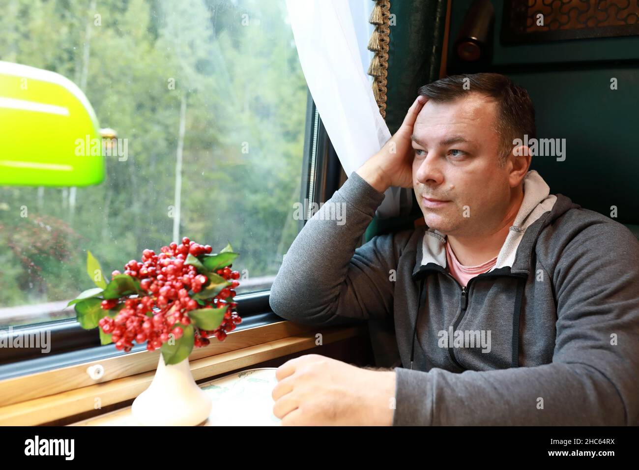 Portrait of serious man in compartment of retro train carriage Stock ...