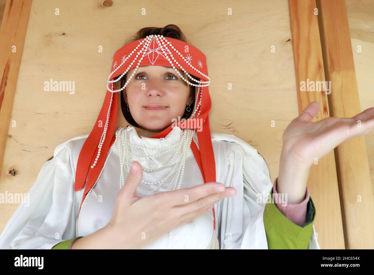 Portrait of woman using face in hole board of Finnish folk Stock Photo ...
