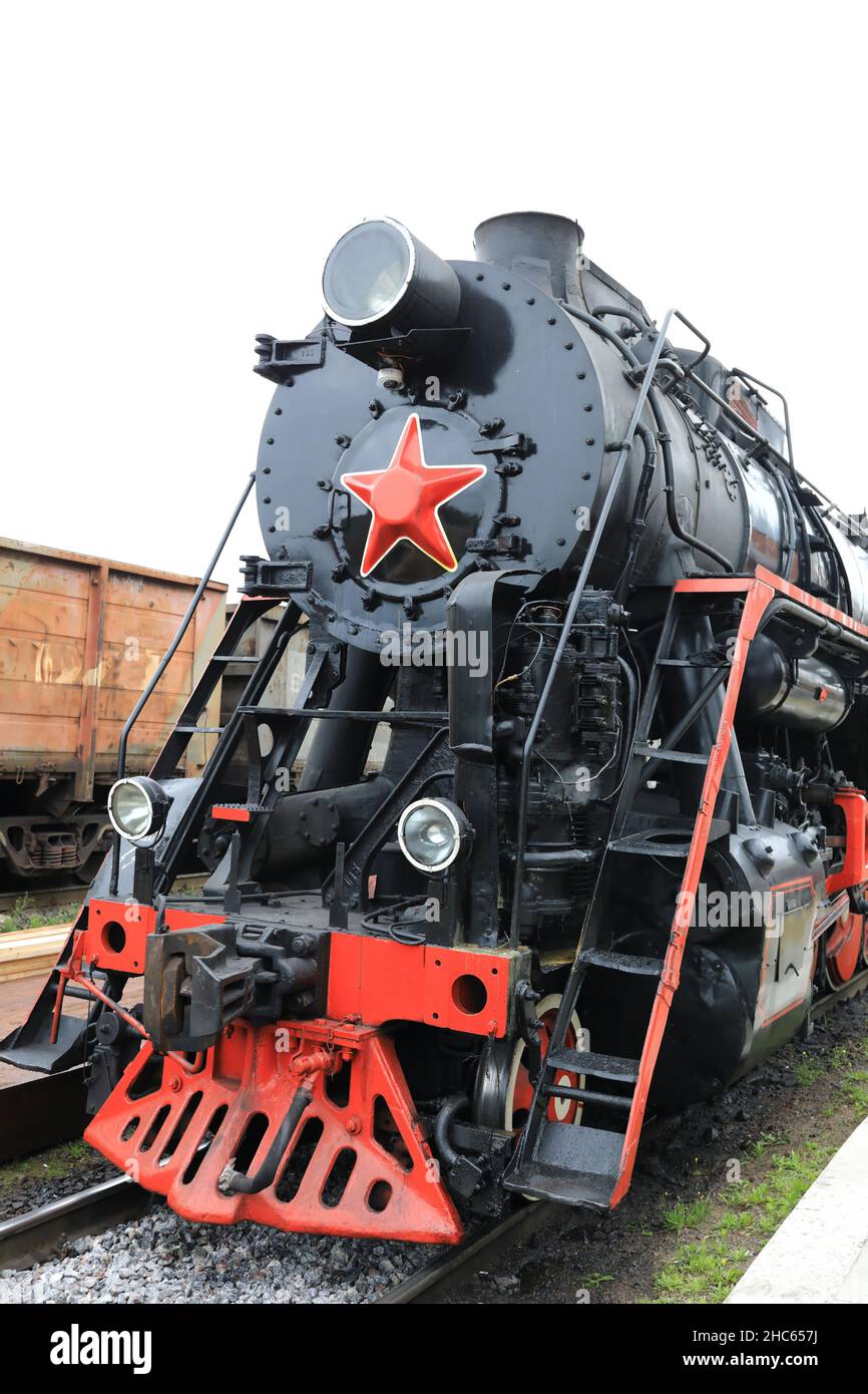 View of steam engine locomotive at railway station Stock Photo - Alamy