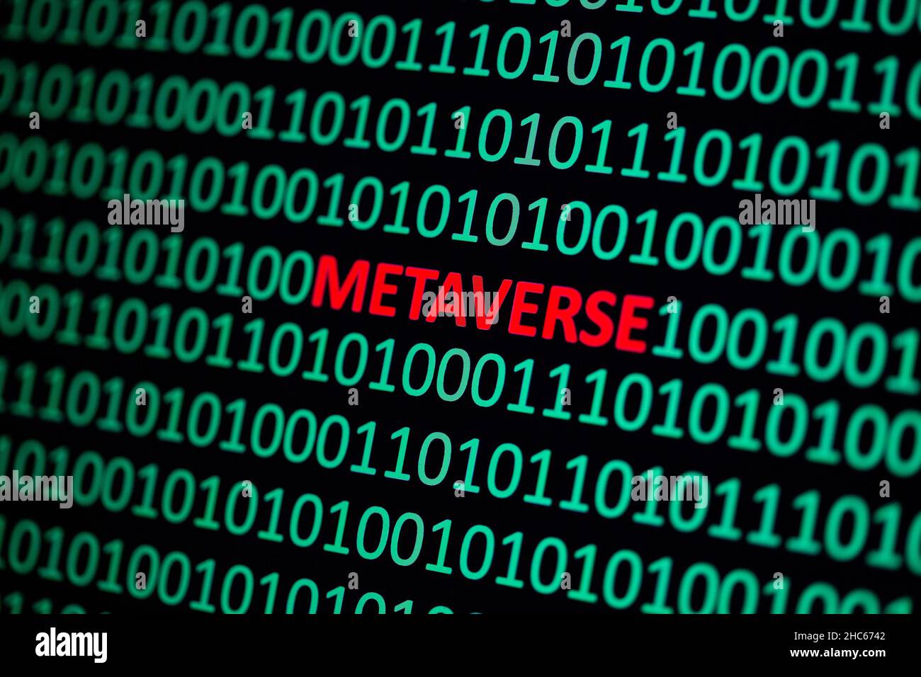 Close up of Binary codes on screen and Metaverse word in the middle ...
